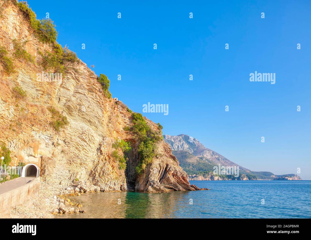 tunnel through the mountain on the beach Stock Photo - Alamy
