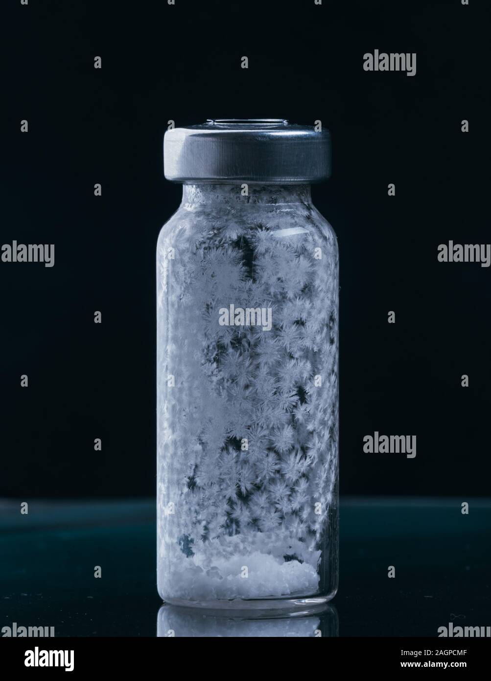 Glass medical ampoule vial for injection. Medicine is dry white drug ...