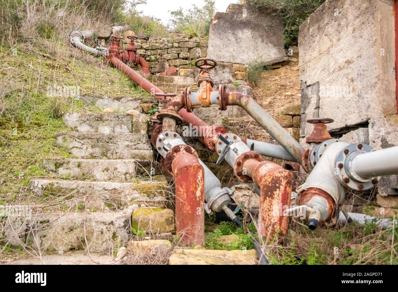 Old rusty pipes in the countryside of Sicily, that once kept the land ...