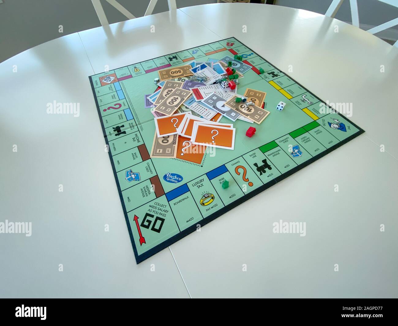 Orlando, FL/USA-12/20/19: Pieces for the game Monopoly by Hasbro on a ...