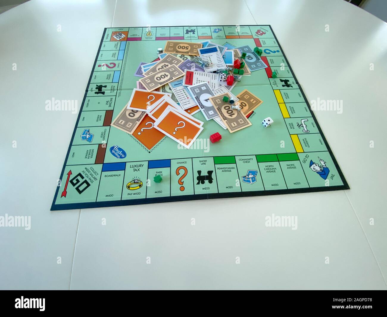 Orlando, FL/USA-12/20/19: Pieces for the game Monopoly by Hasbro on a ...