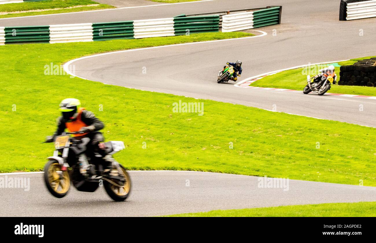 Motorbikes race around the famous track at Cadwell Park, in England, UK ...