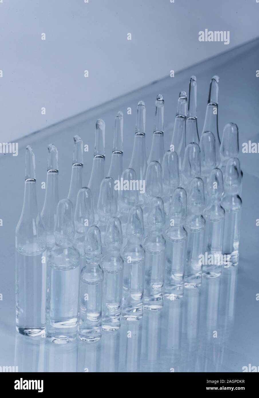 Glass medical ampoule vial for injection. Medicine is dry white drug ...