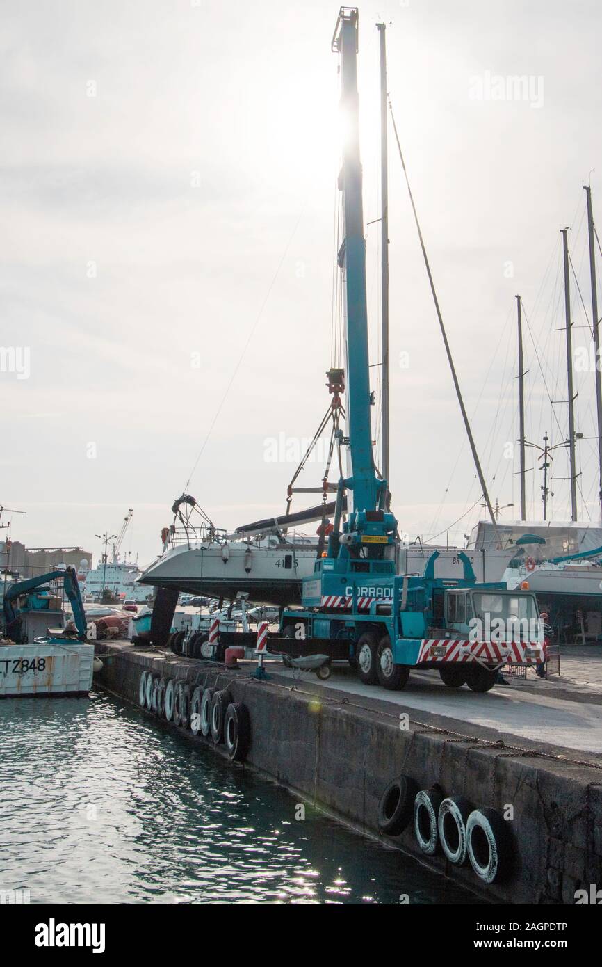 Boat being lifted by a crane hi-res stock photography and images - Alamy