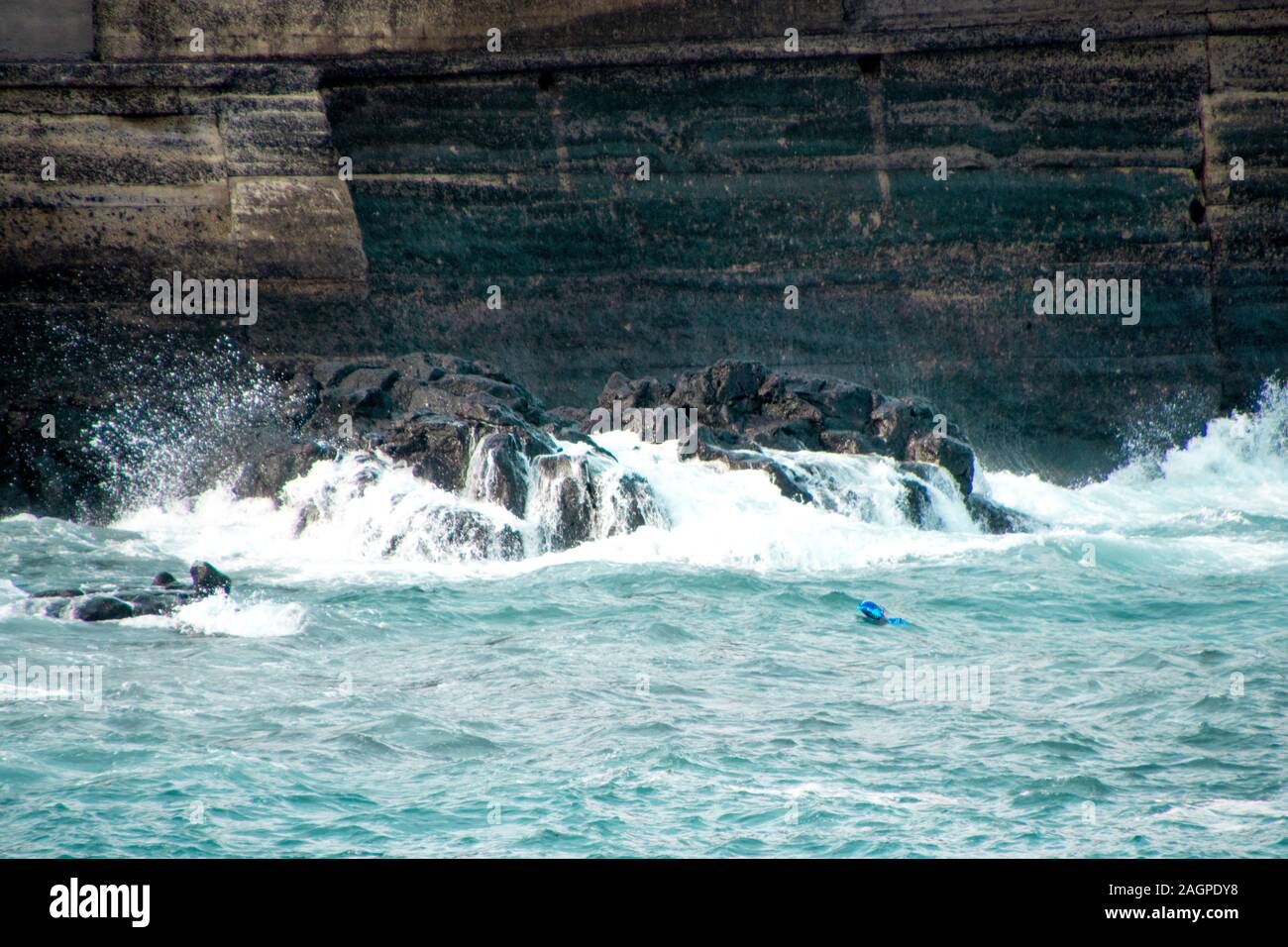 The coast of Catania harbor being battered by large waves during bad ...