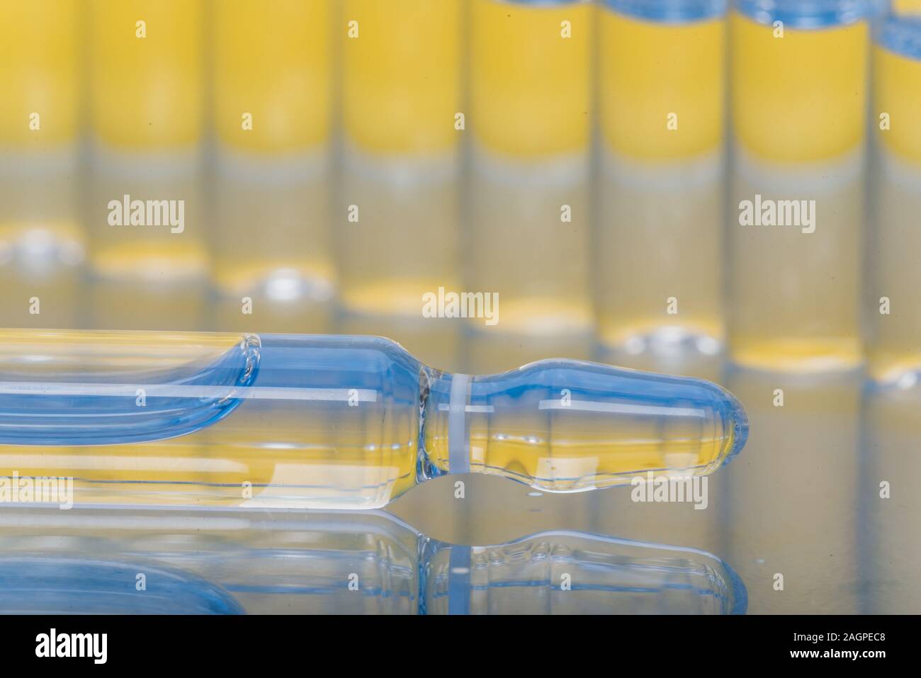 Glass medical ampoule vial for injection. Medicine is liquid sodium ...