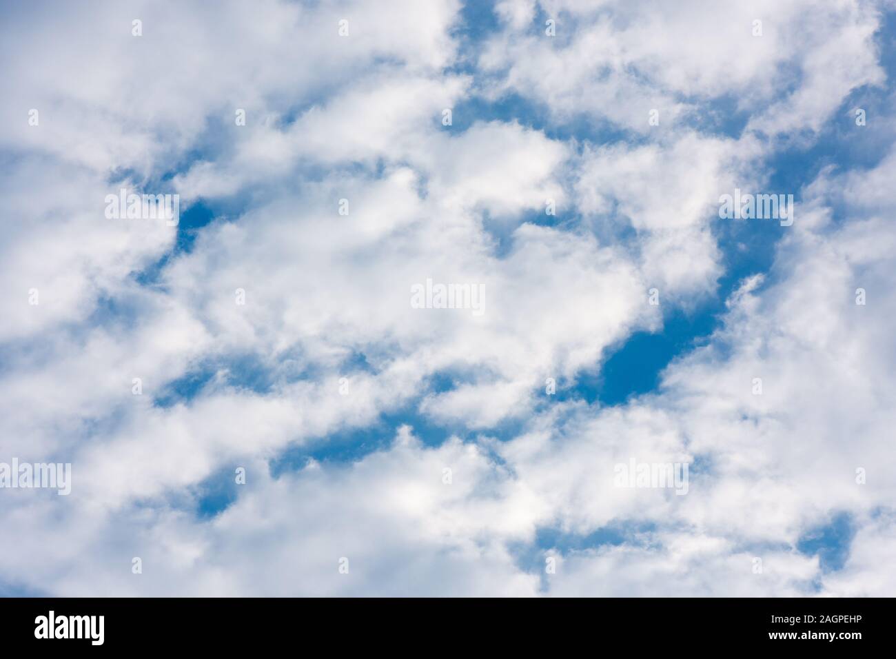 blue clouds on the sky in the rays of sun in the fall. Landscape ...