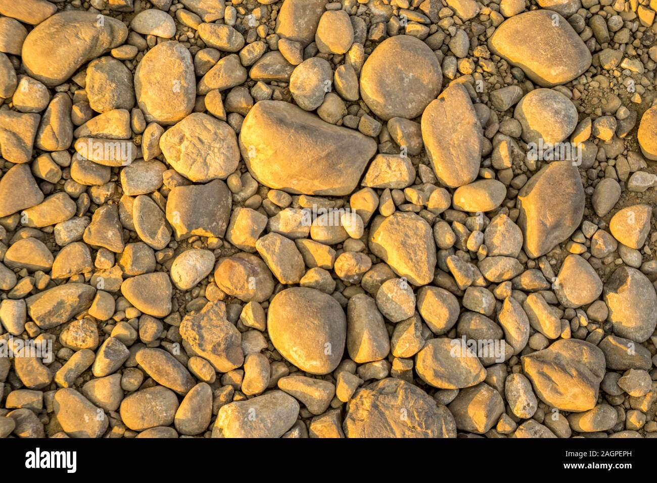 A collection of random sized stones on the ground, which will make a ...