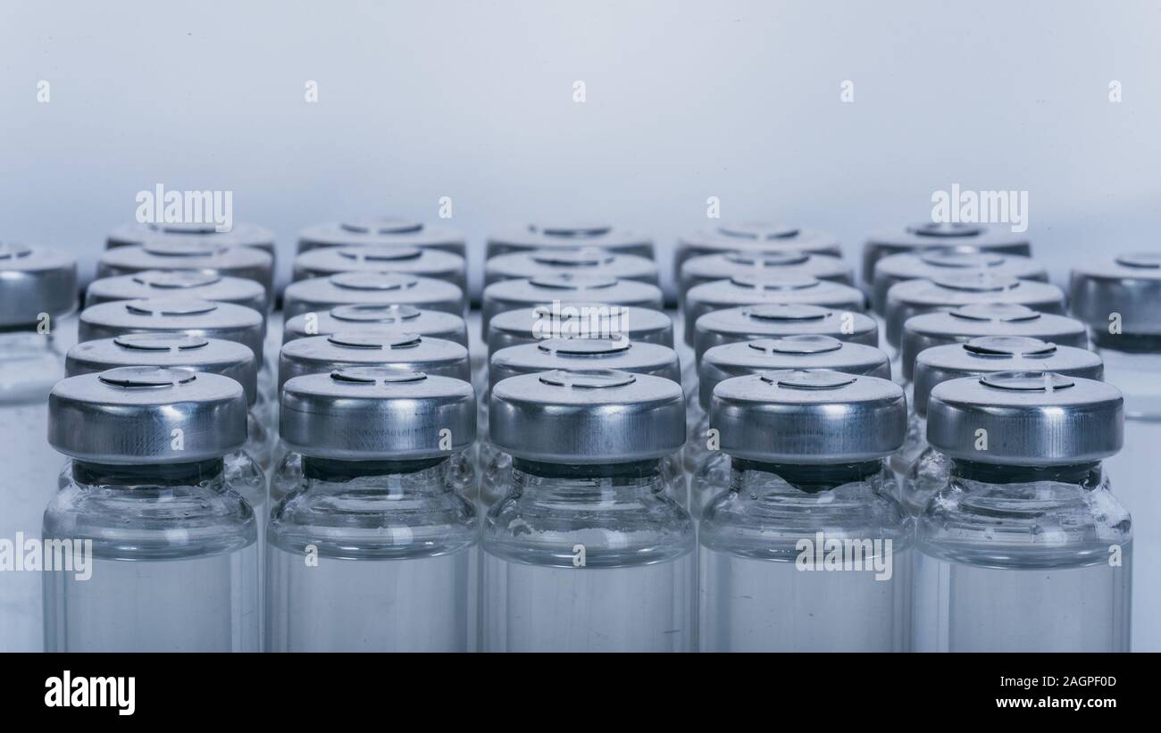 Glass medical ampoule vial for injection. Medicine is dry white drug ...