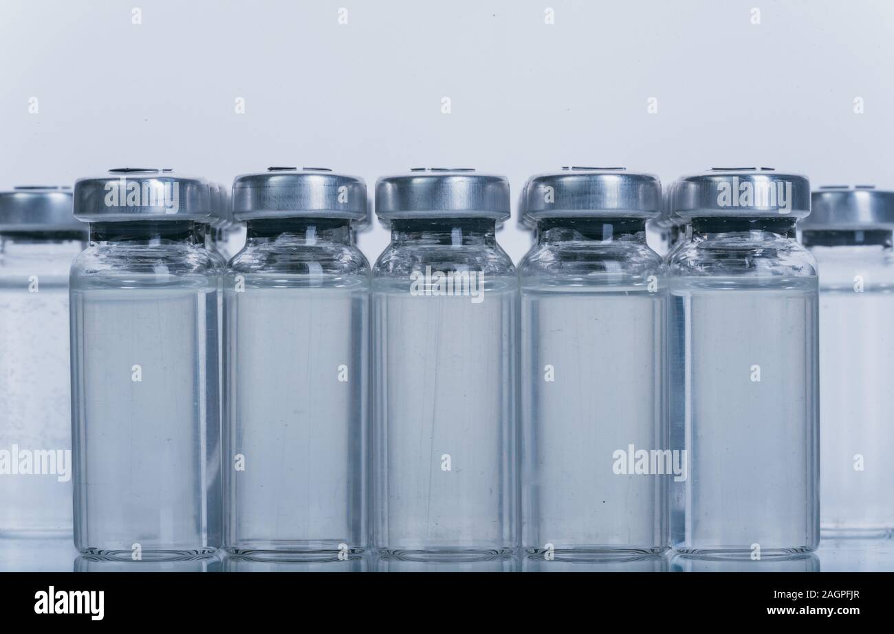 Glass medical ampoule vial for injection. Medicine is dry white drug ...