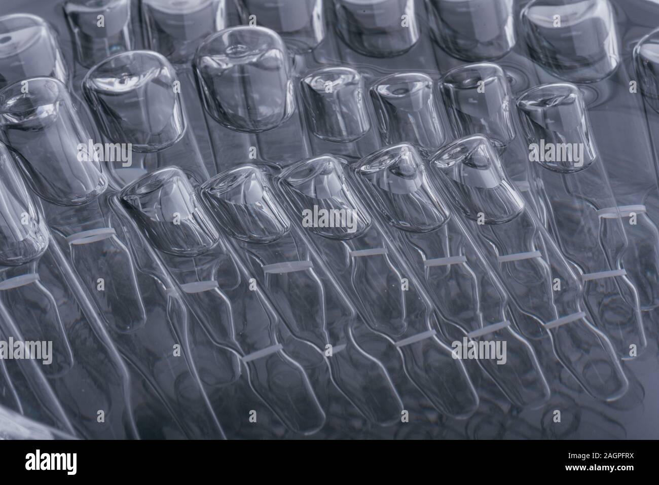 Glass medical ampoule vial for injection. Medicine is liquid sodium ...