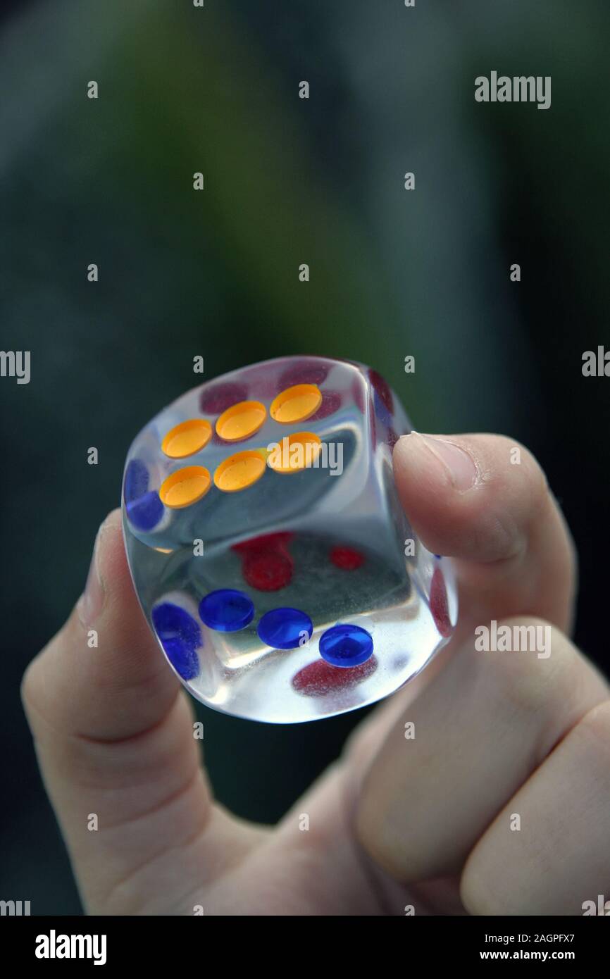 Kid holding dice in his hand. Dice in kids hand Stock Photo - Alamy