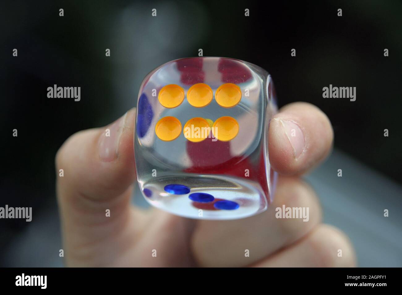 Kid holding dice in his hand. Dice in kids hand Stock Photo - Alamy