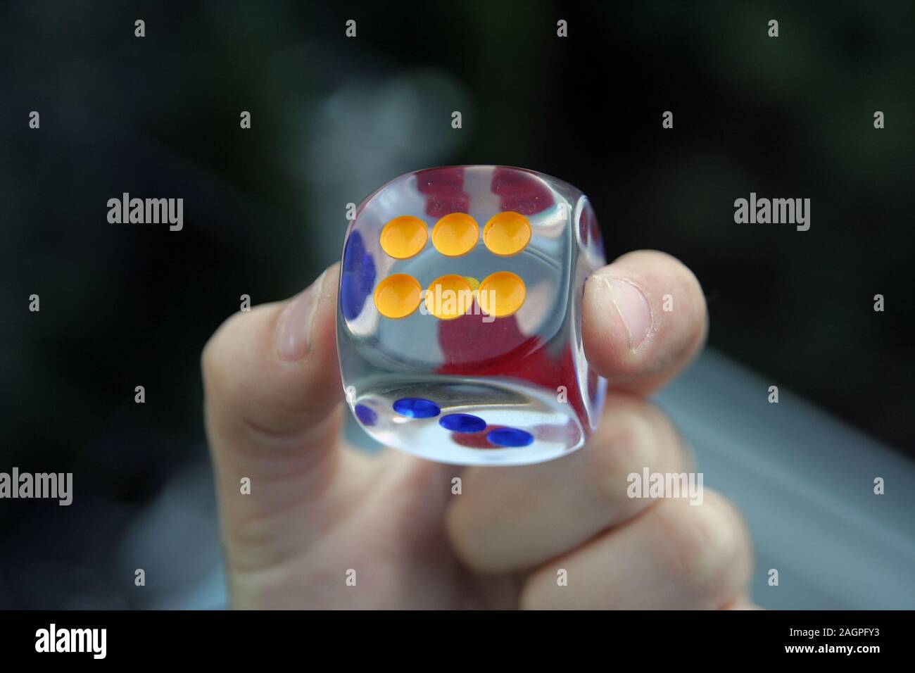 Kid holding dice in his hand. Dice in kids hand Stock Photo - Alamy