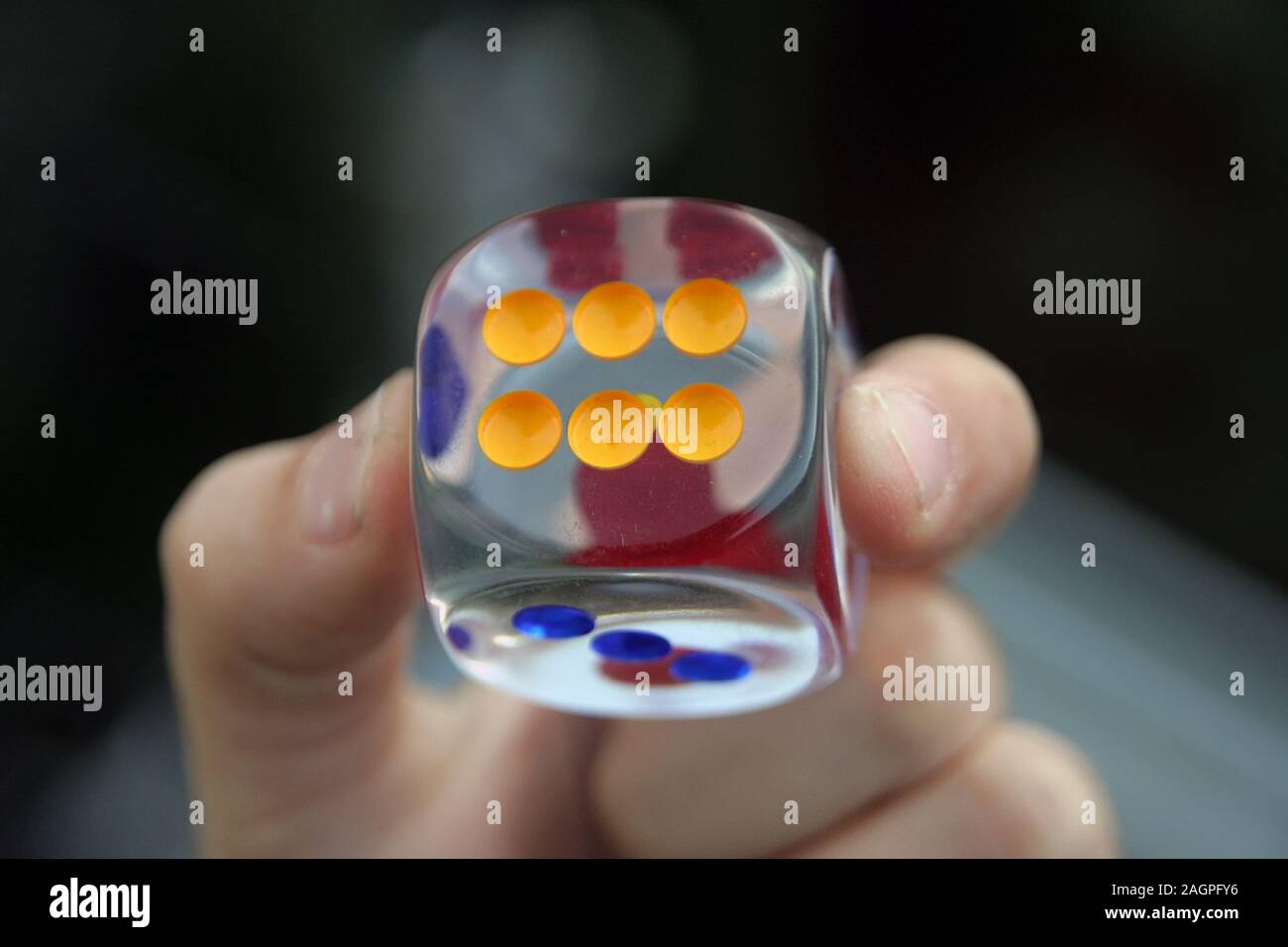 Kid holding dice in his hand. Dice in kids hand Stock Photo - Alamy