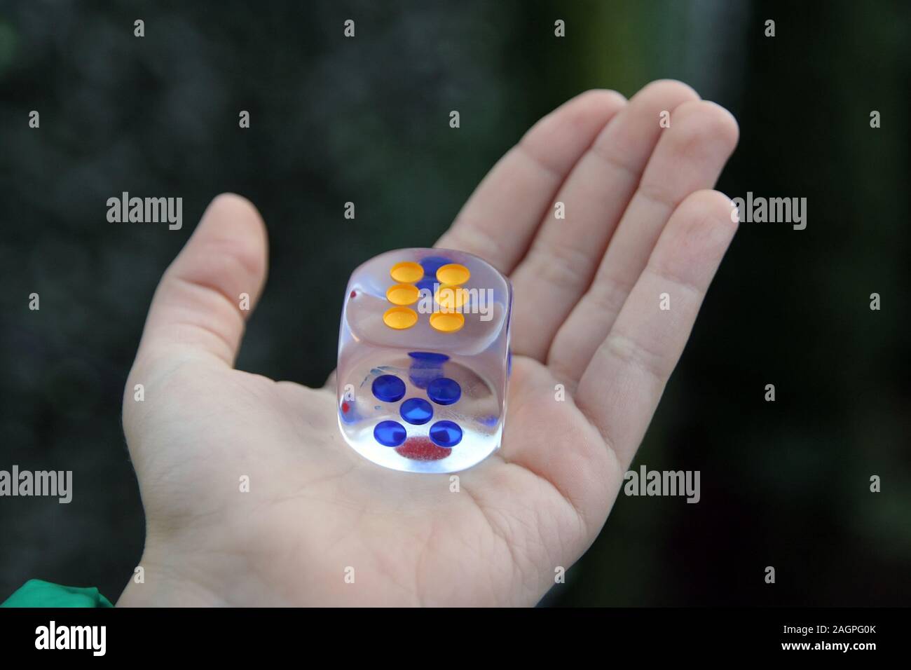 Kid holding dice in his hand. Dice in kids hand Stock Photo - Alamy