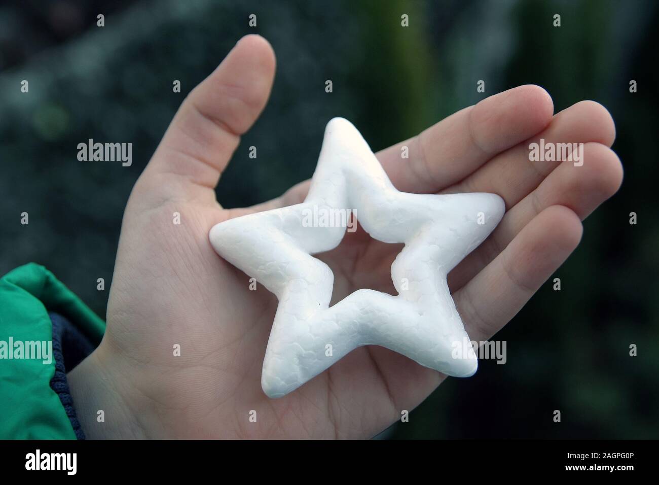 Kid with star in his hand. Decoration star in kids hand. Star holiday ...
