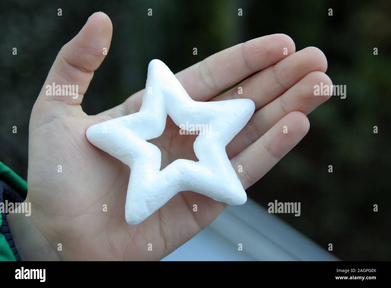 Kid with star in his hand. Decoration star in kids hand. Star holiday ...