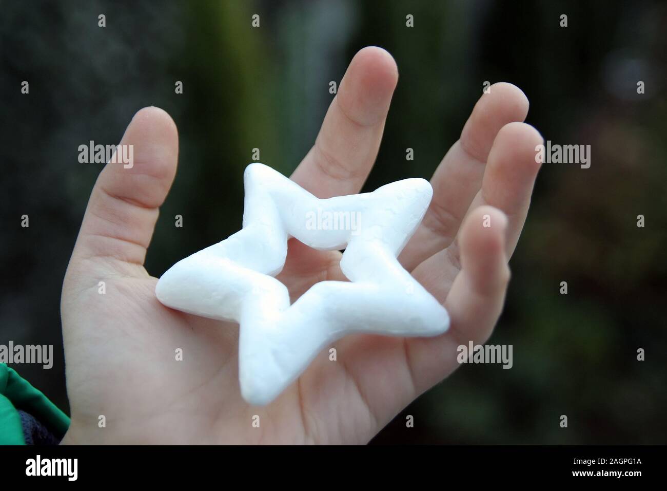 Kid with star in his hand. Decoration star in kids hand. Star holiday ...