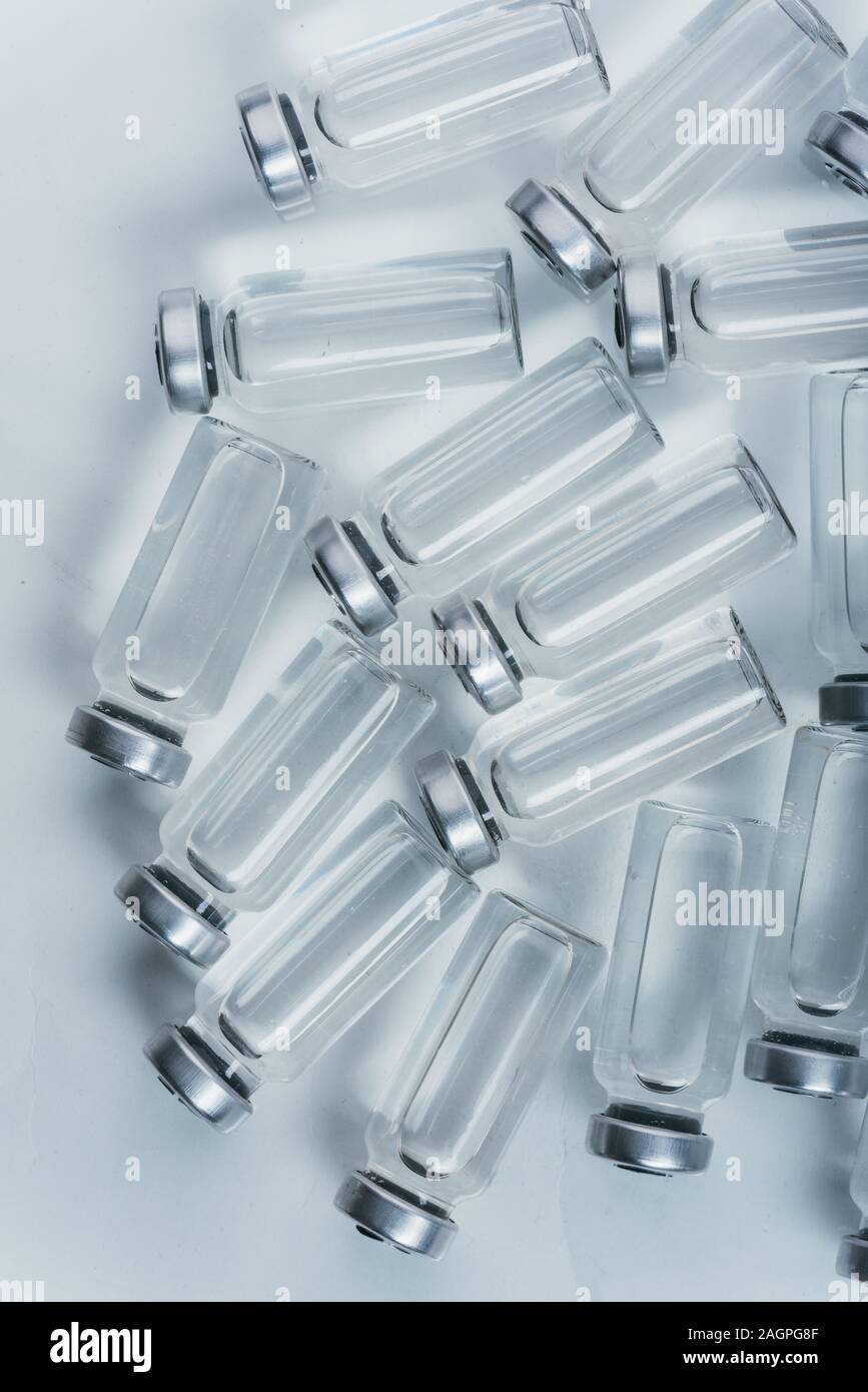 Glass medical ampoule vial for injection. Medicine is dry white drug ...