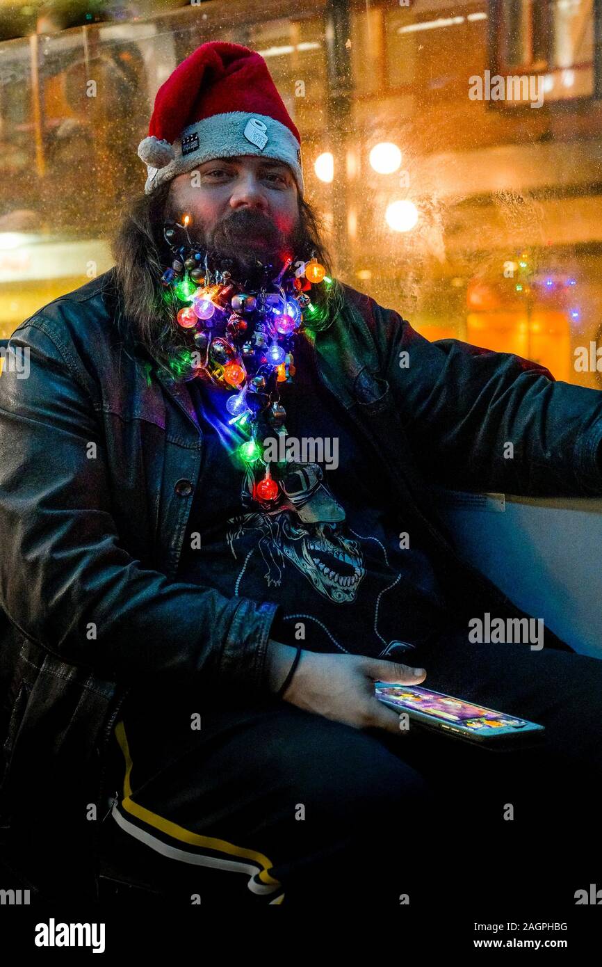 Being the light. Man brightening up the bus ride on a dreary Vancouver ...
