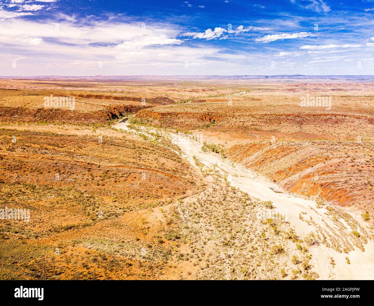 A dry creek bed downstream of Glen Helen Gorge, West MacDonnell Ranges ...