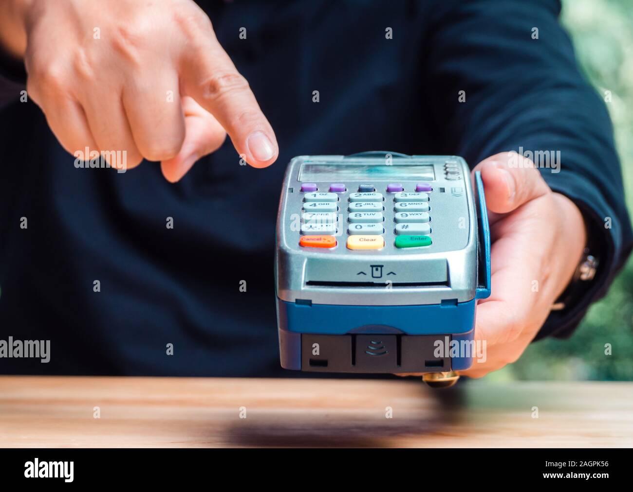 Male's hand with payment credit card through terminal for shopping ...