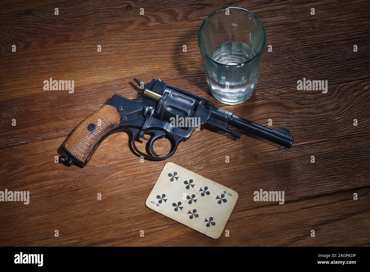 russian roulette - Nine of Clubs plaing card, glass of vodka and ...