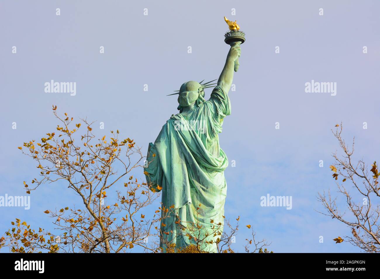 Closeup of the Statue of Liberty from behind with autumn trees Stock ...