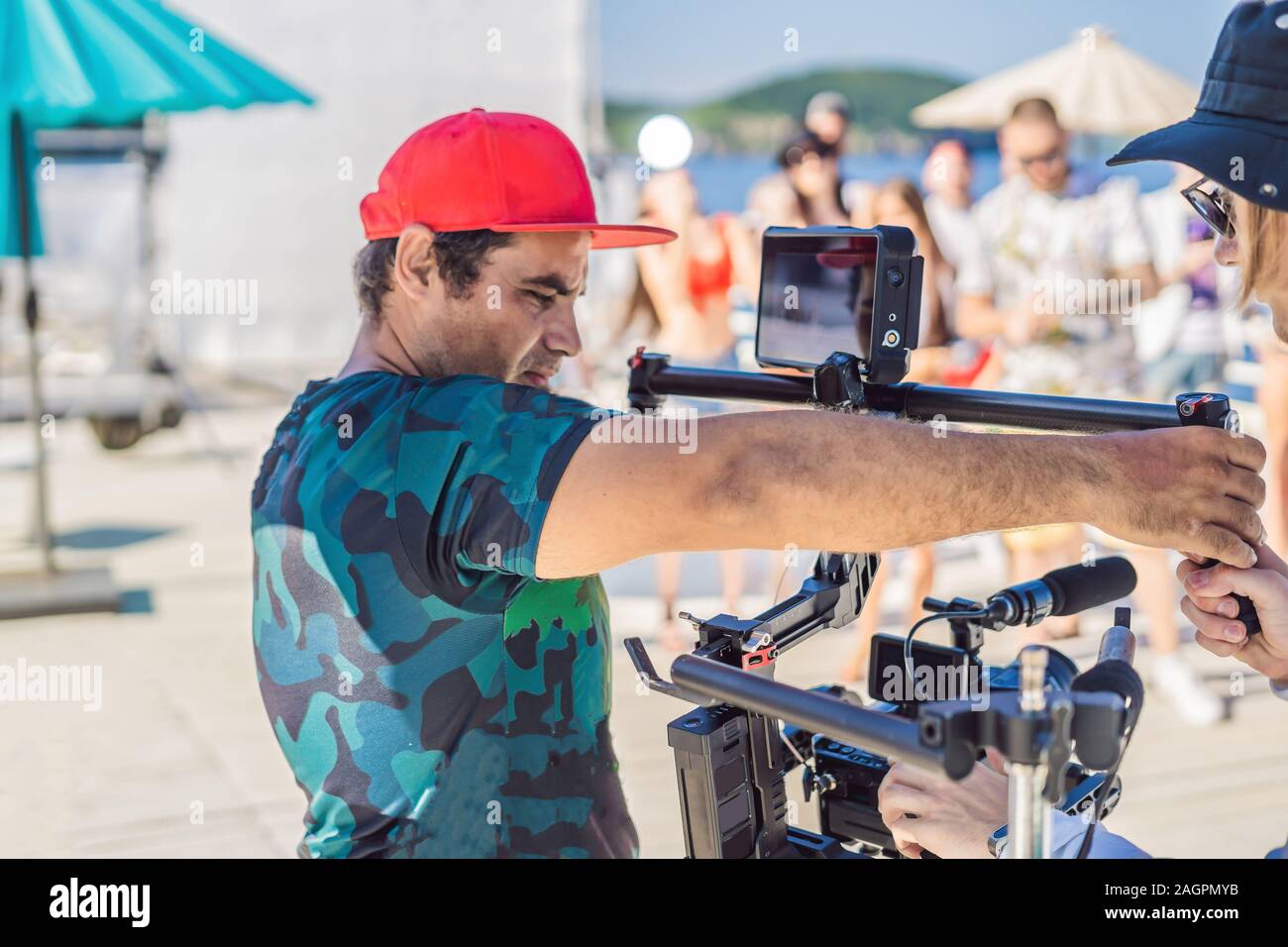 Professional steadicam operator uses a 3-axis camera stabilizer system ...