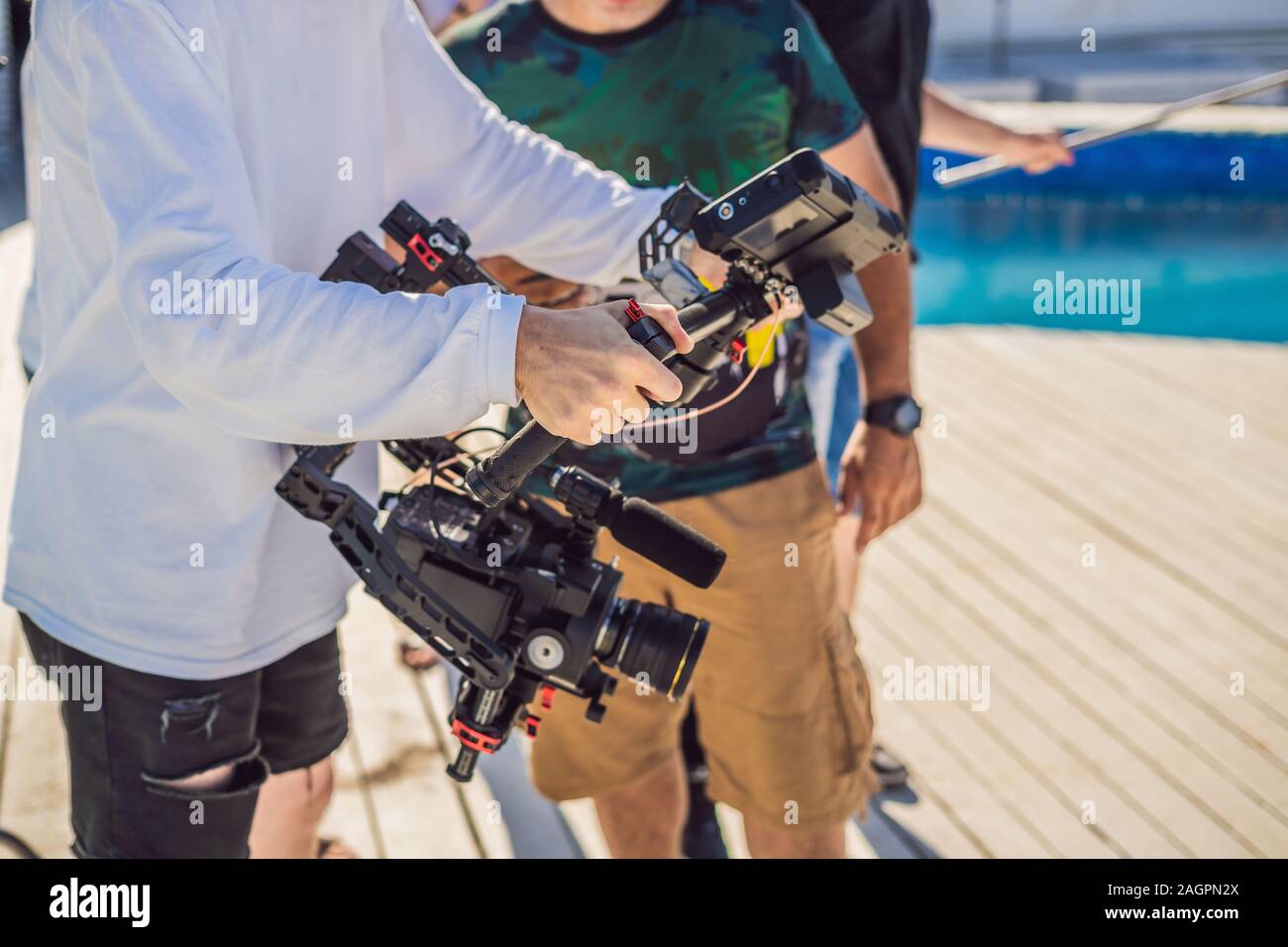 Professional steadicam operator uses a 3-axis camera stabilizer system ...