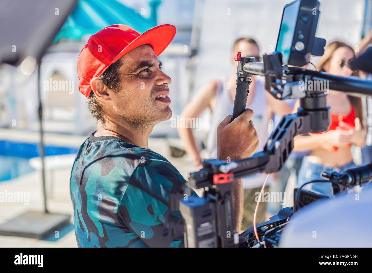 Professional steadicam operator uses a 3-axis camera stabilizer system ...