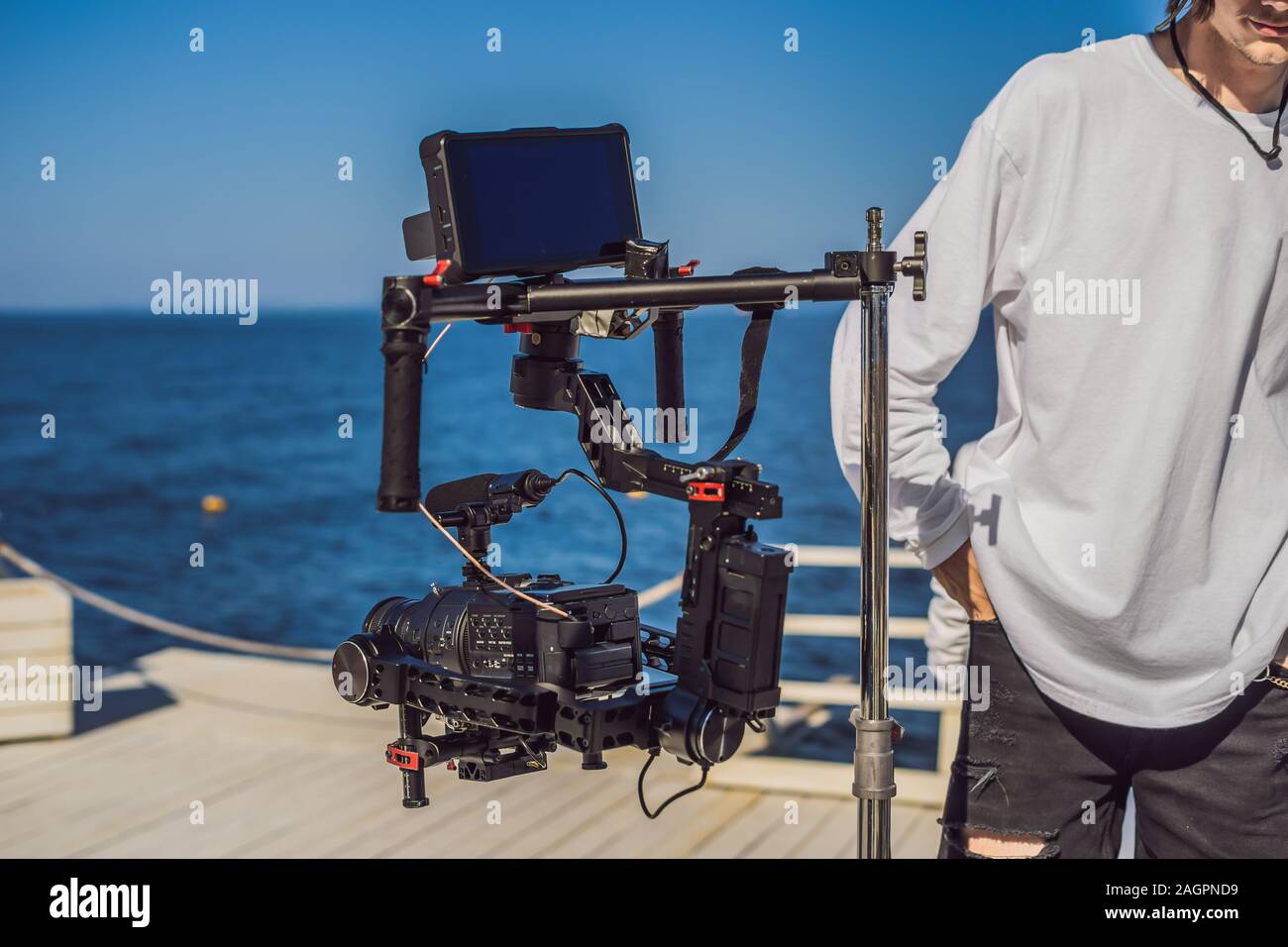 profeccional cinema camera on a 3-axis camera stabilizer system on a ...