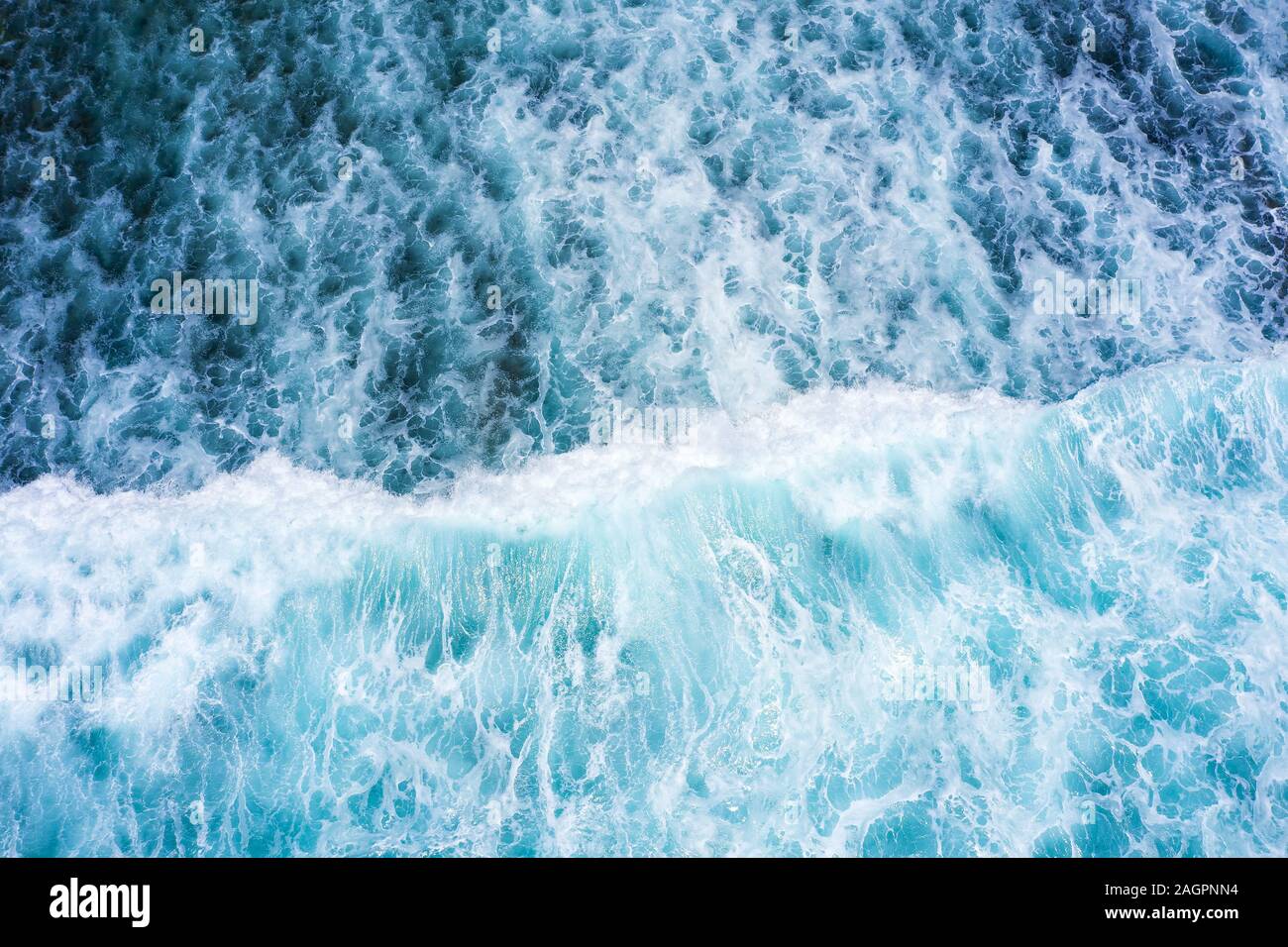 View from above, stunning aerial view of some ocean waves that forms a ...