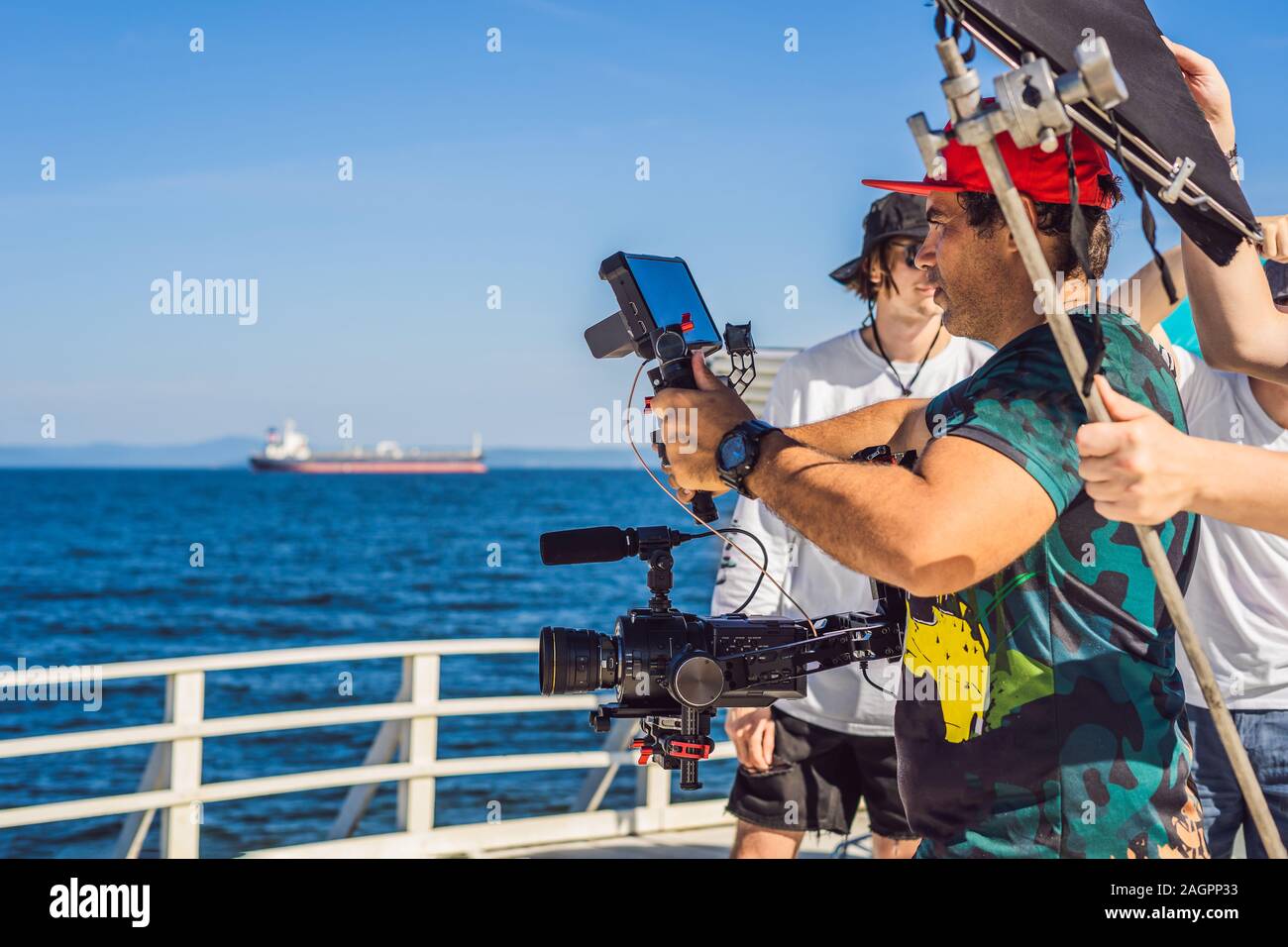Professional steadicam operator uses a 3-axis camera stabilizer system ...