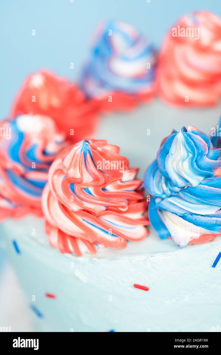 Red, white, and blue round cake frosted with buttercream frosting Stock ...