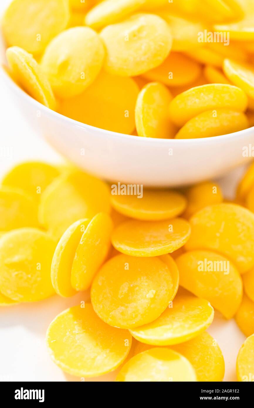 Yellow round chocolate chips for melting chocolate shapes Stock Photo ...