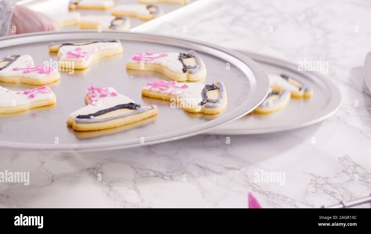 Icing figure skate shaped sugar cookies with royal icing Stock Photo ...