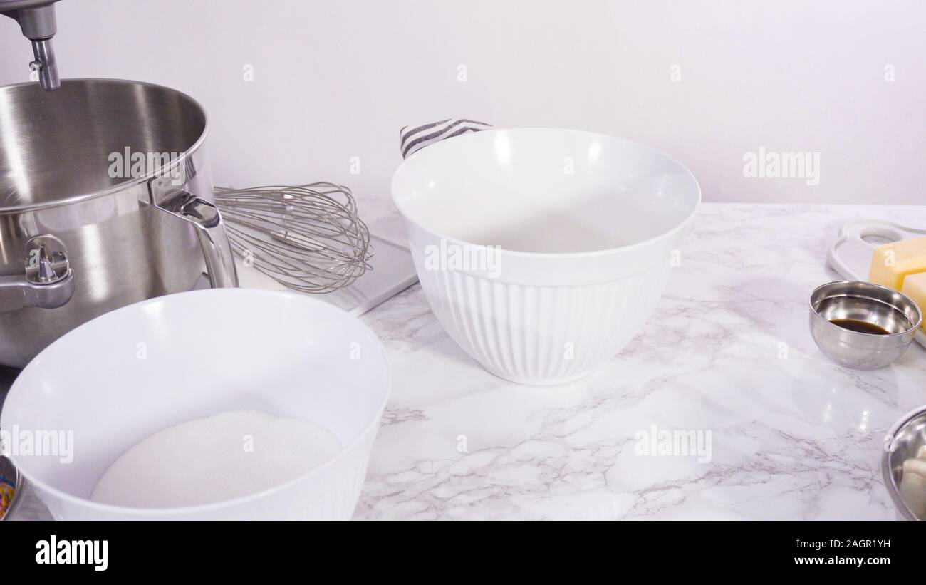 Step by step. Mixing ingredients in standing kitchen mixer to bake ...