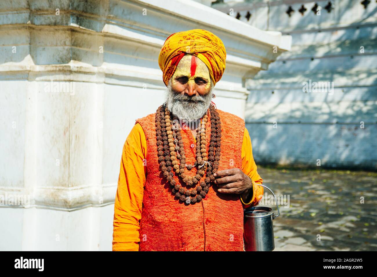 Sadhu man with traditional painted face in Pashupatinath Temple of ...