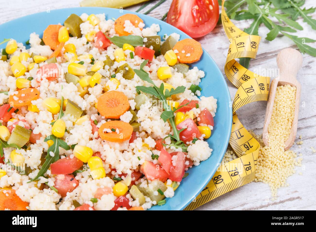 Fresh salad with vegetables and couscous groats. Light meal containing ...