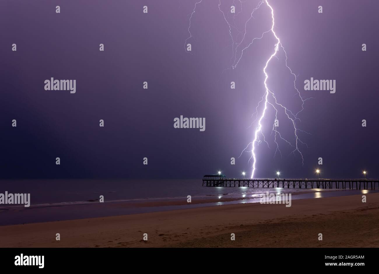 Big lightning bolt strike over Henley beach Stock Photo - Alamy