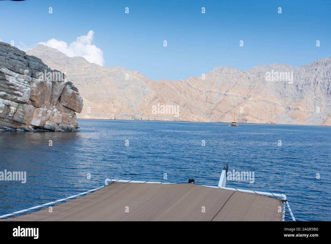 View from Dhow Boat to spectacular rocky mountains of northern Oman in ...