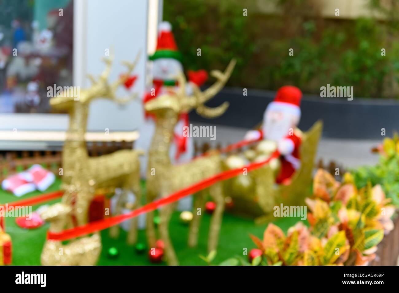 santa claus and reindeer and snowman at blurred focus in outdoor ...
