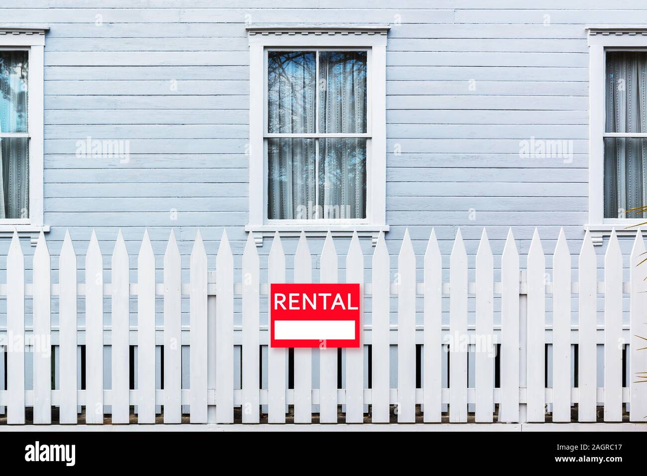 Rental real estate signboard on fence of house Stock Photo - Alamy