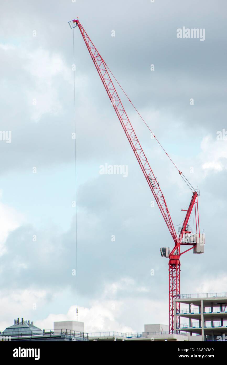 A tall crane stands high above the city of London, United Kingdom Stock ...