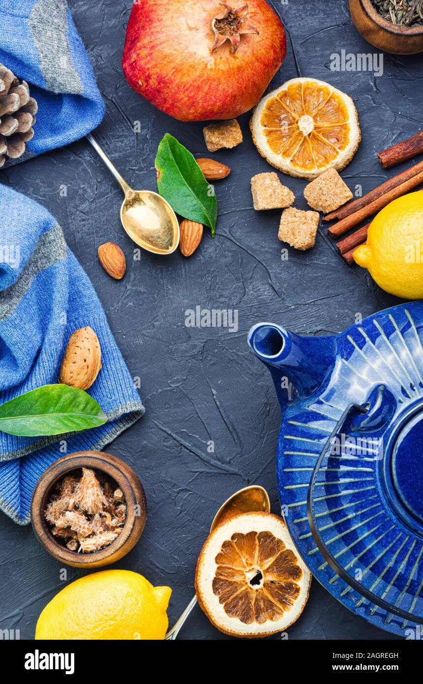 Natural ingredients for tea.Porcelain blue teapot.Useful tea with lemon ...