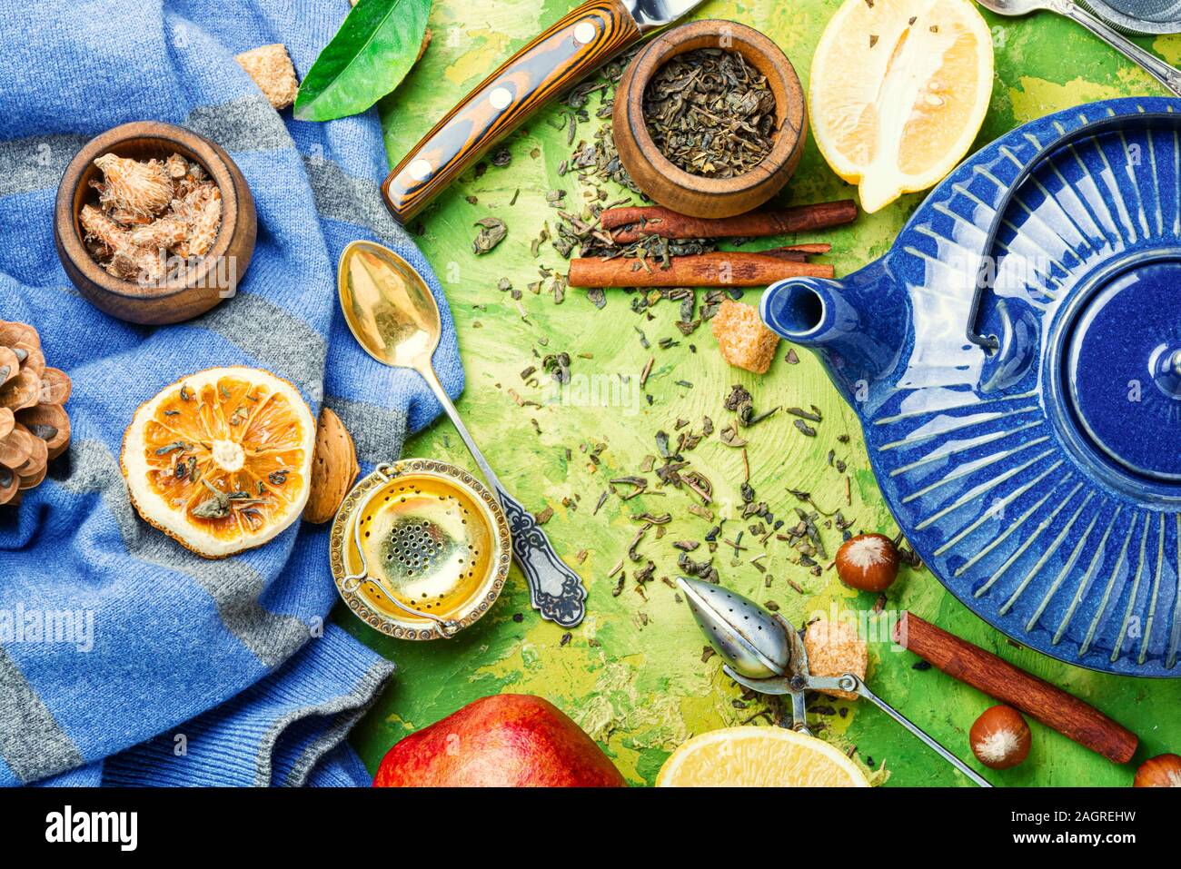 Natural ingredients for tea.Porcelain blue teapot.Useful tea with lemon ...