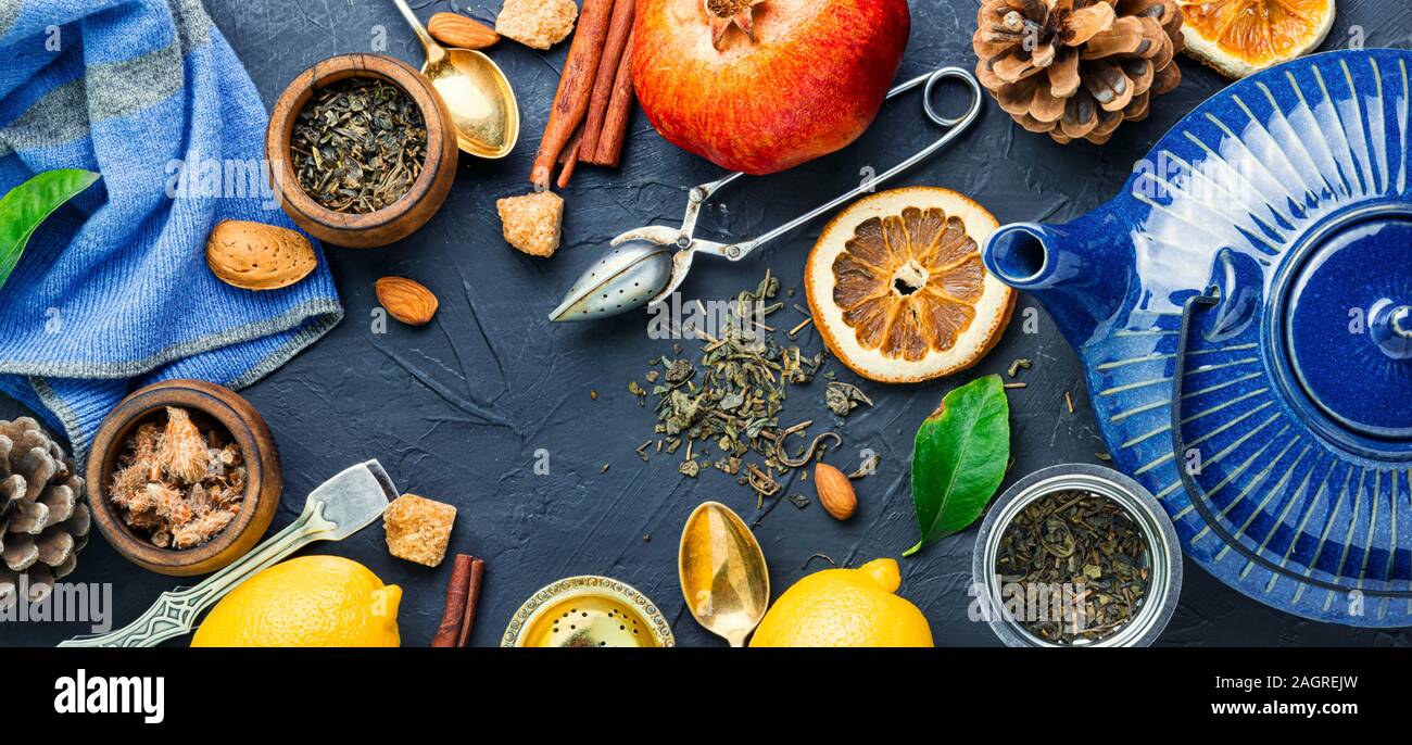 Natural ingredients for tea.Porcelain blue teapot.Useful tea with lemon ...