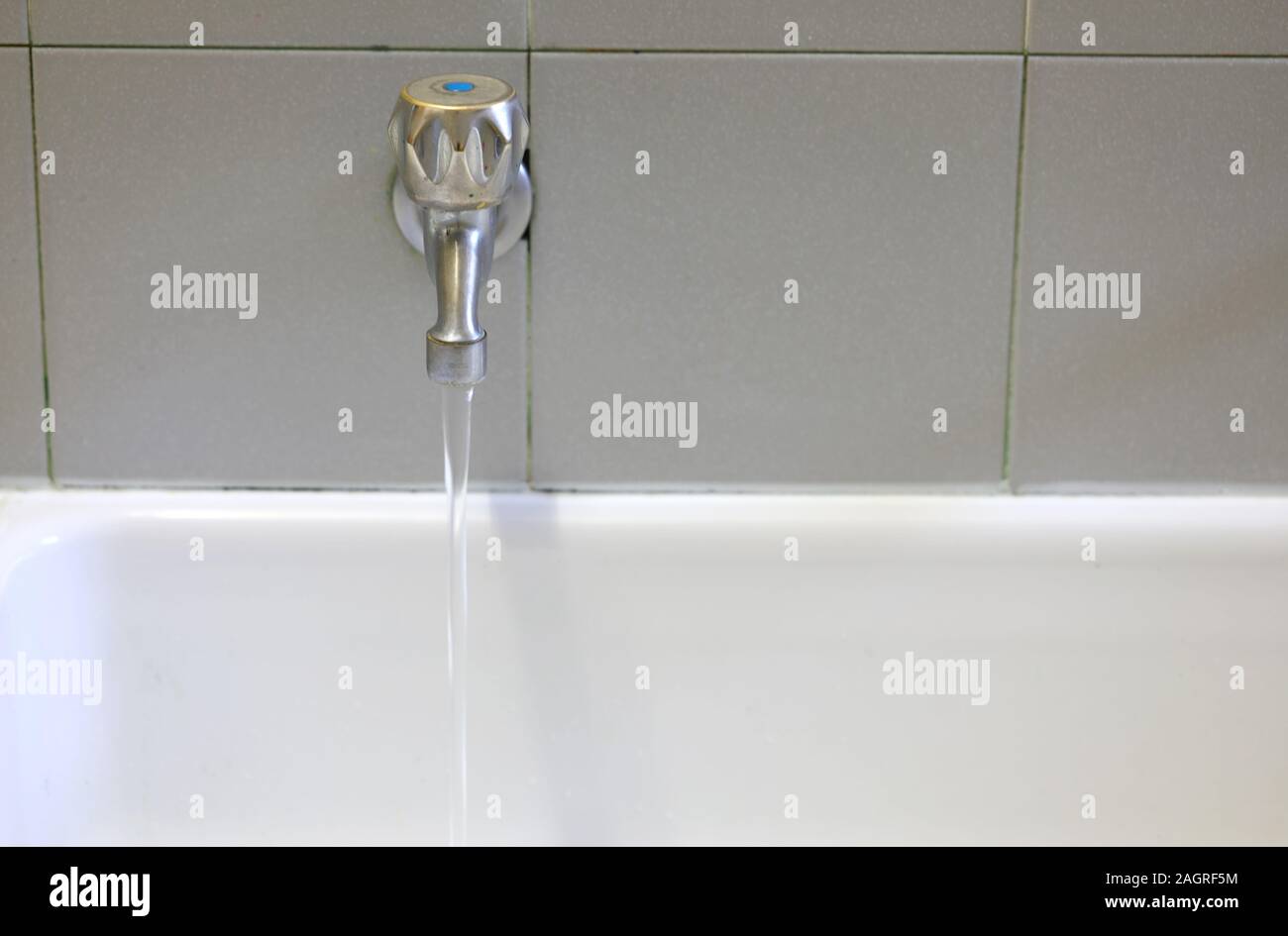 One opened tap with fresh flushing potable water Stock Photo - Alamy